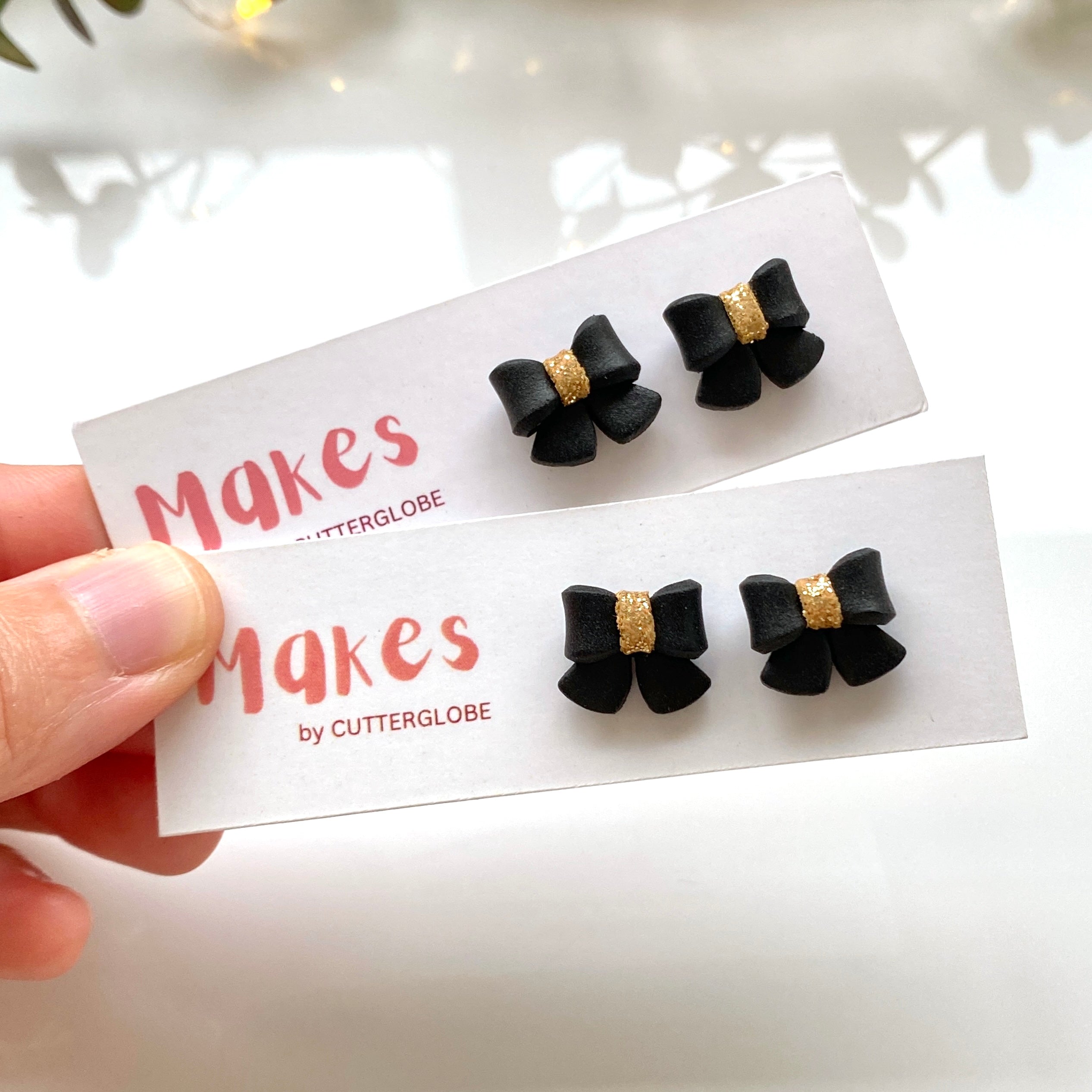 Black Glitter Strip Bow Stud – Cutterglobe